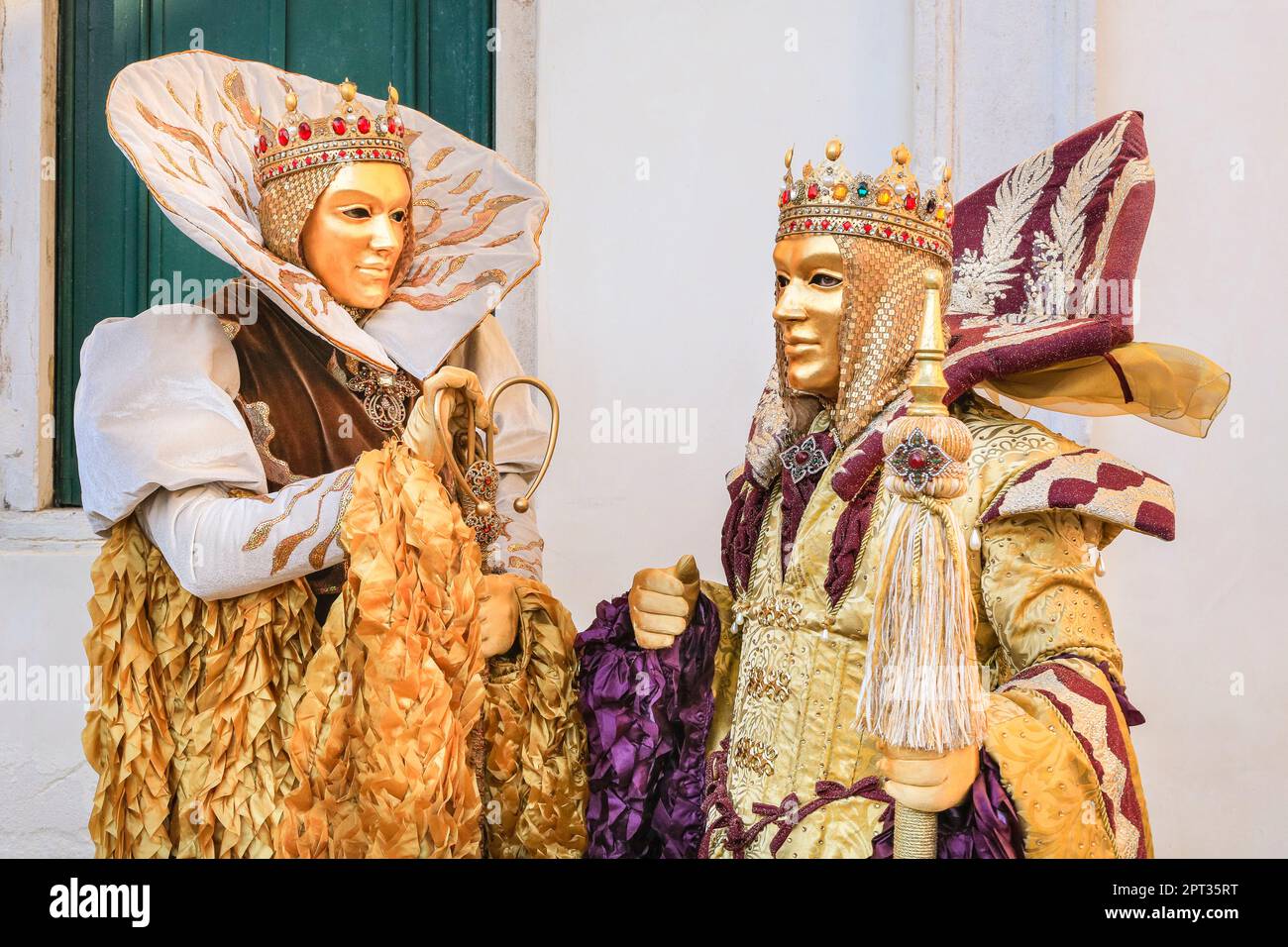 Venice Carnival costumed participants pose in medieval baroque costumes ...