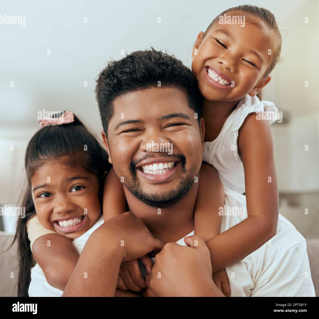 Family, father and children, hug and happy together in portrait at ...