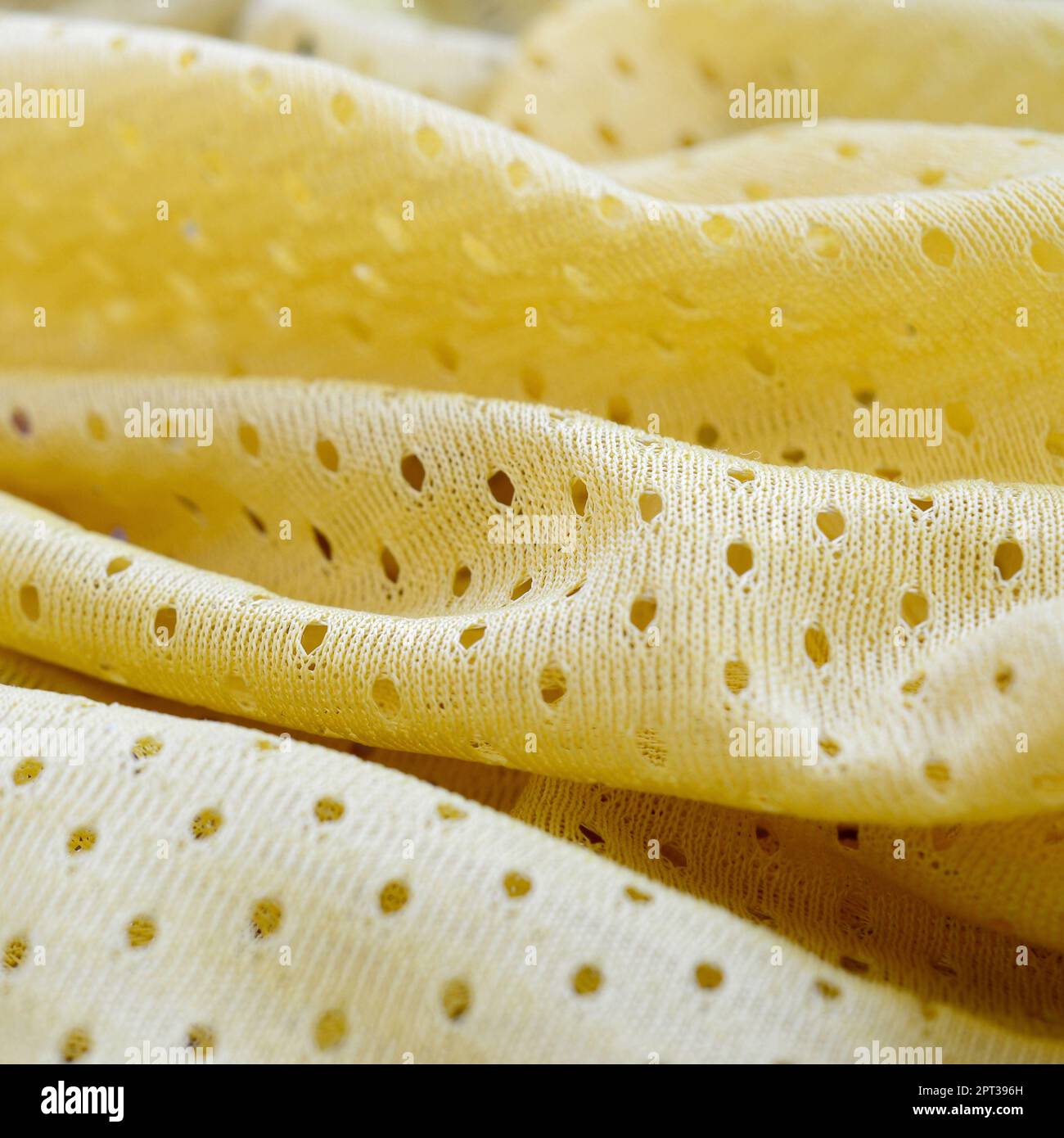 Yellow mesh sport wear fabric textile pattern background. Yellow color ...