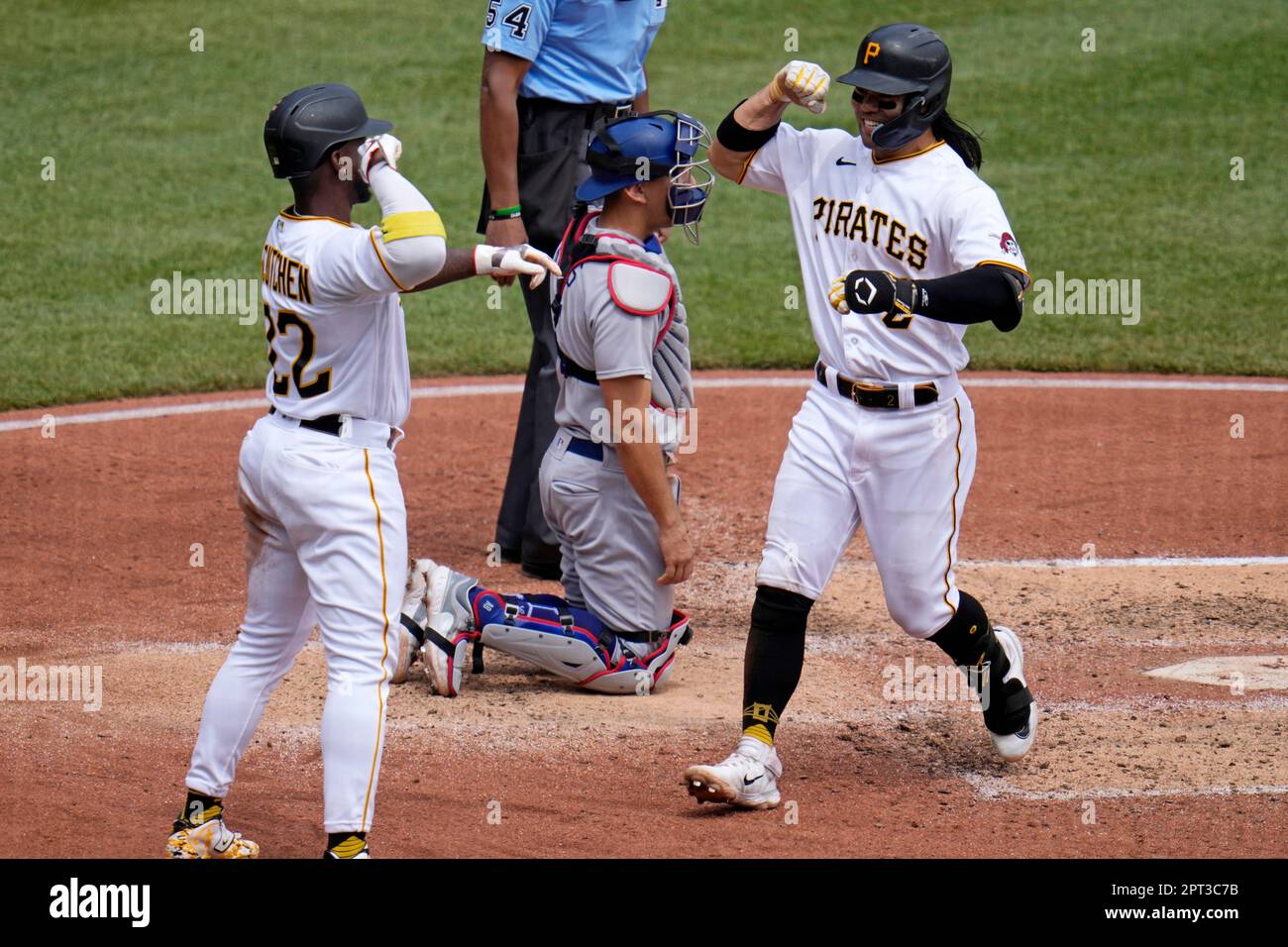 Pittsburgh Pirates' Connor Joe, right, is greeted by Andrew McCutchen ...