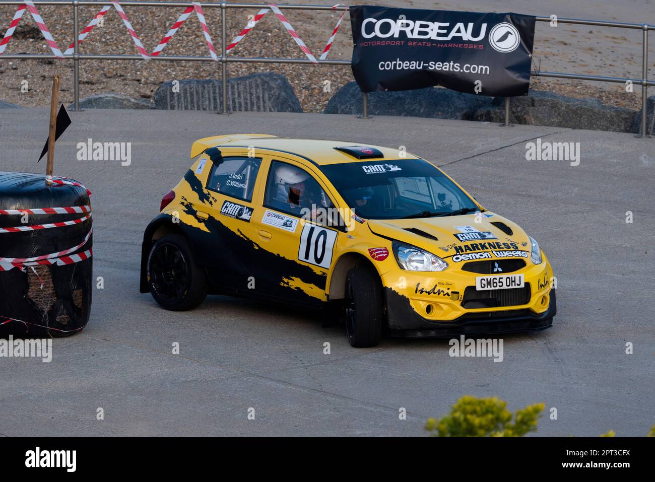 John Indri racing a Mitsubishi Mirage R5 competing in the Corbeau Seats ...