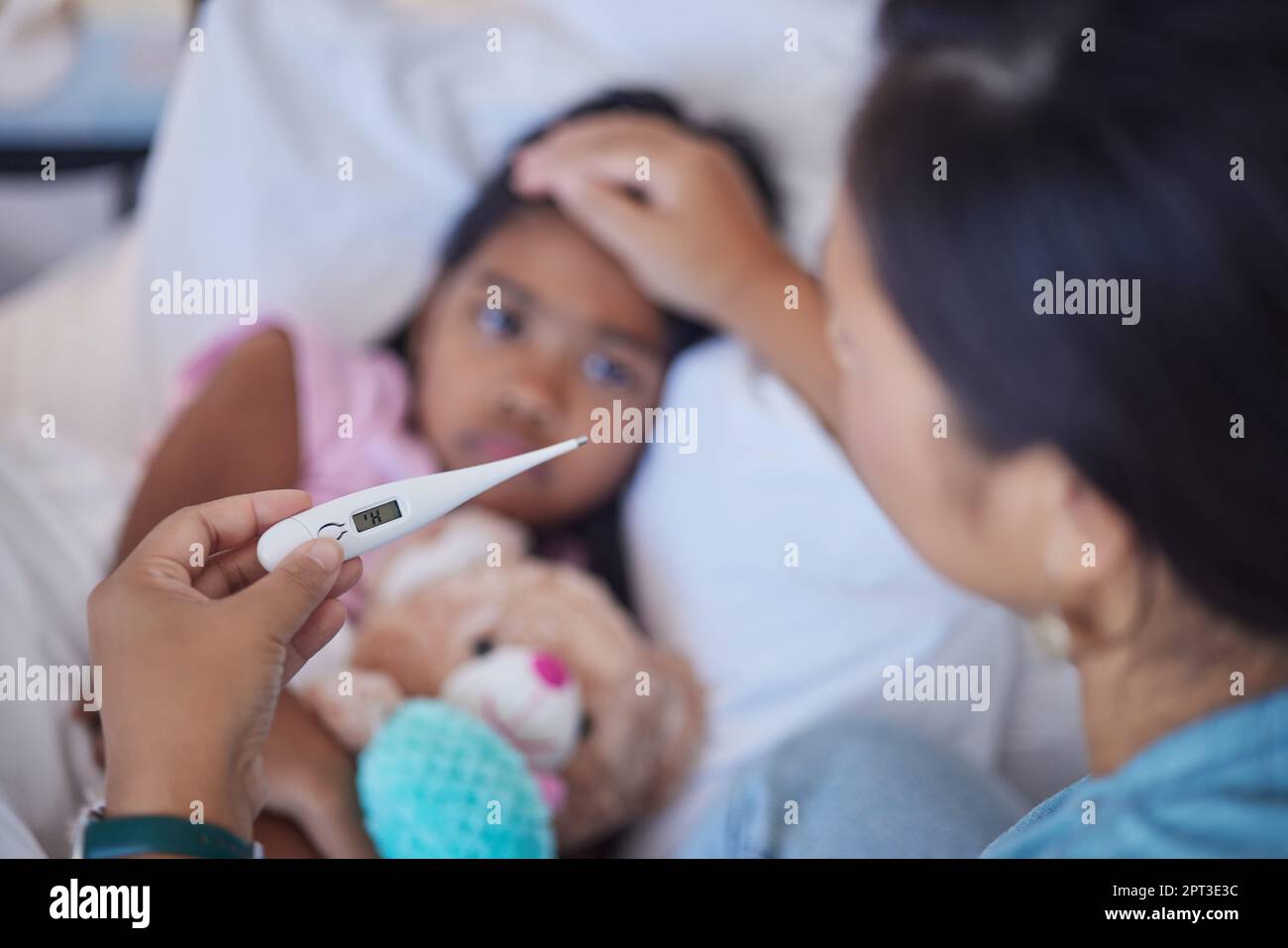 Medical home thermometer, mother check sick child and .check results of girl covid virus in ...