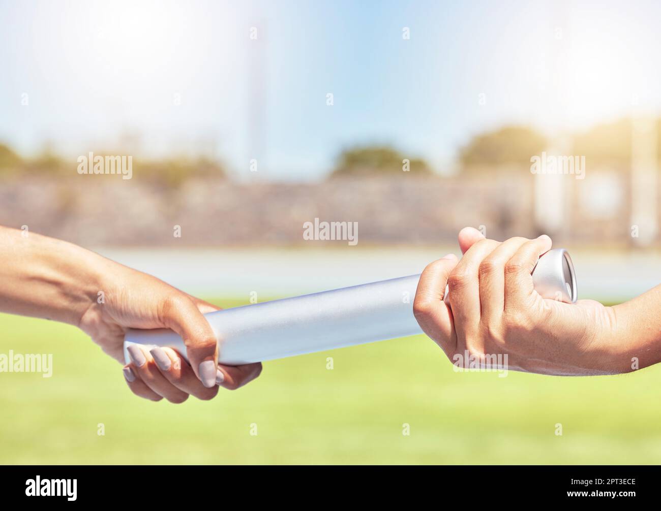 Passing the baton in a relay race hi-res stock photography and images ...