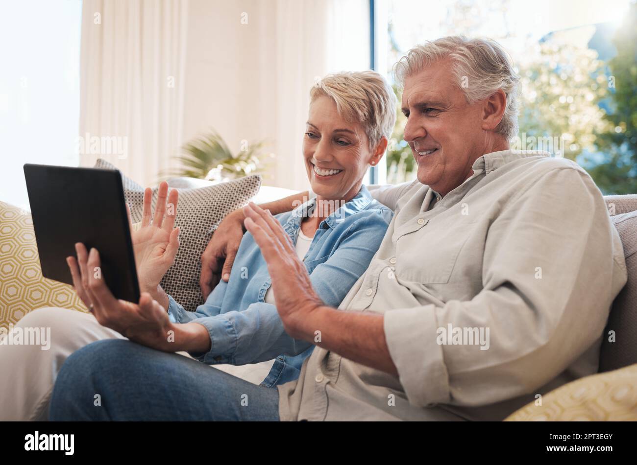 Senior couple digital tablet, wave and video call with a talking on the ...