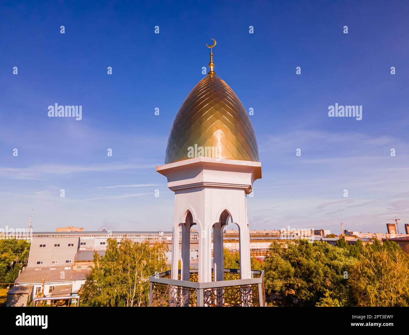 A Muslim golden dome with a crescent moon on the mosque. Minaret ...