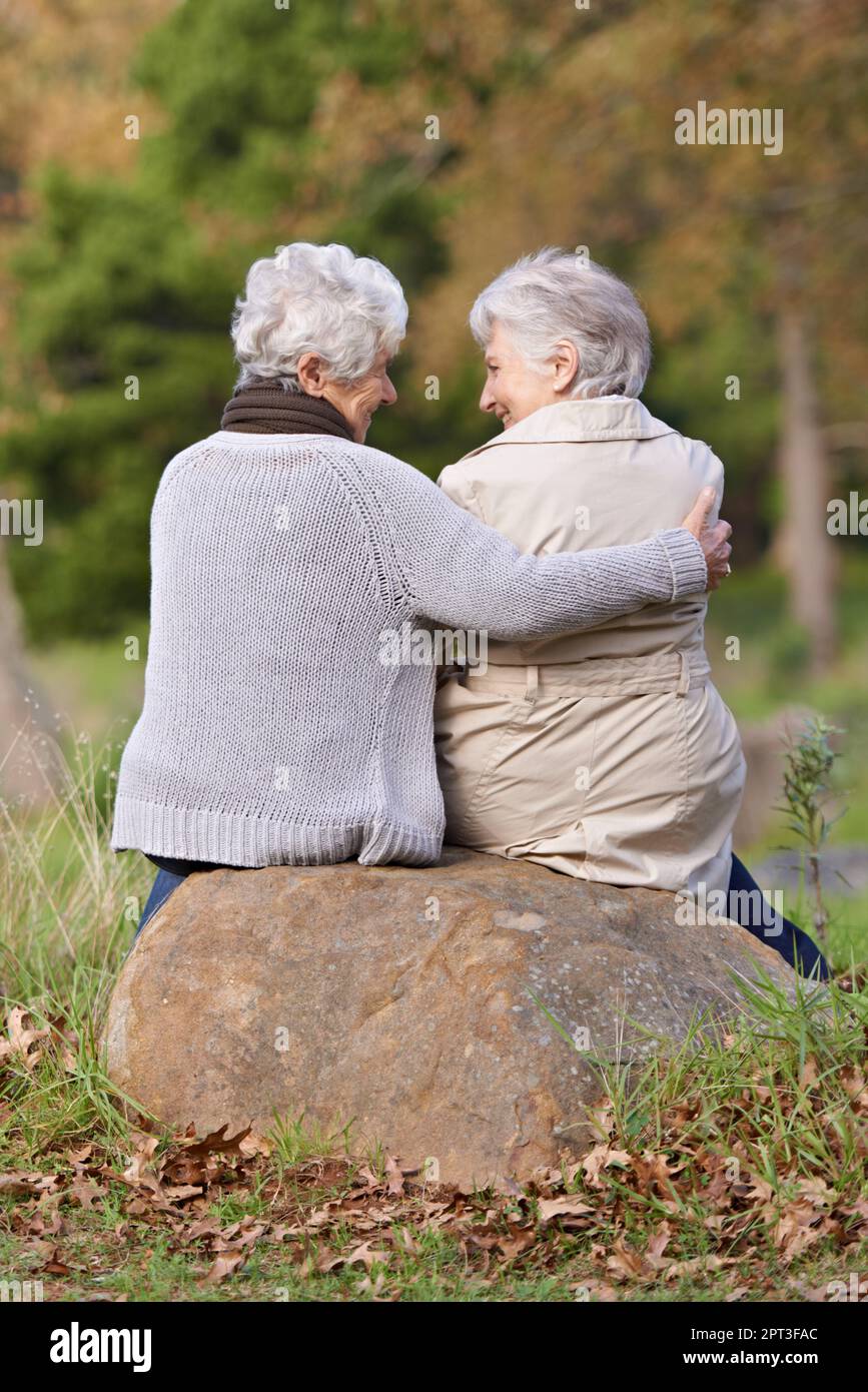 Taking a moments reflection on life. Rear view of two senior women ...