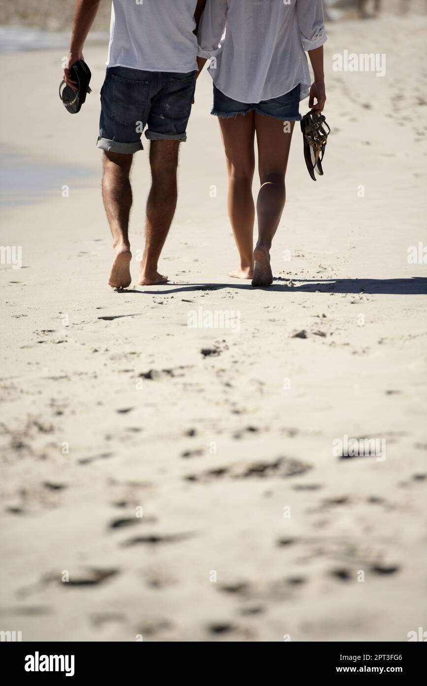 Seaside stroll. Cropped image of a couple walking on the beach Stock ...