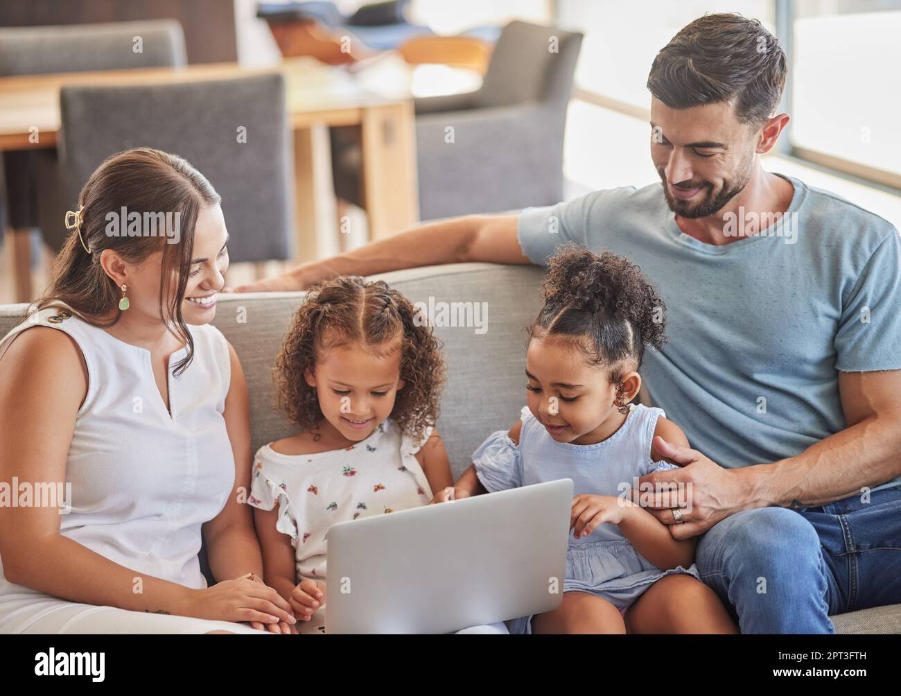 Parents watching kids on internet hi-res stock photography and images ...