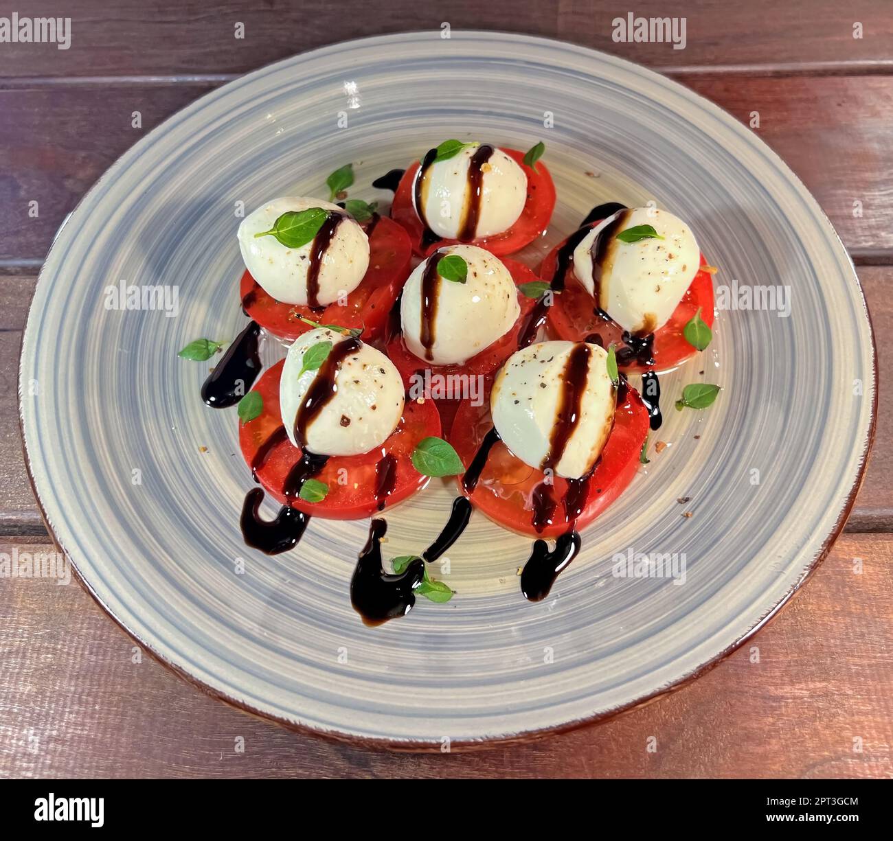 Tomato and mozzarella Caprese salad with sauce Stock Photo - Alamy