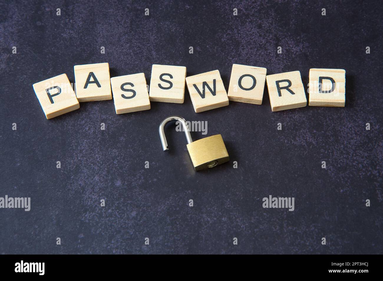 Word "password" written in wooden letters next to a padlock ...