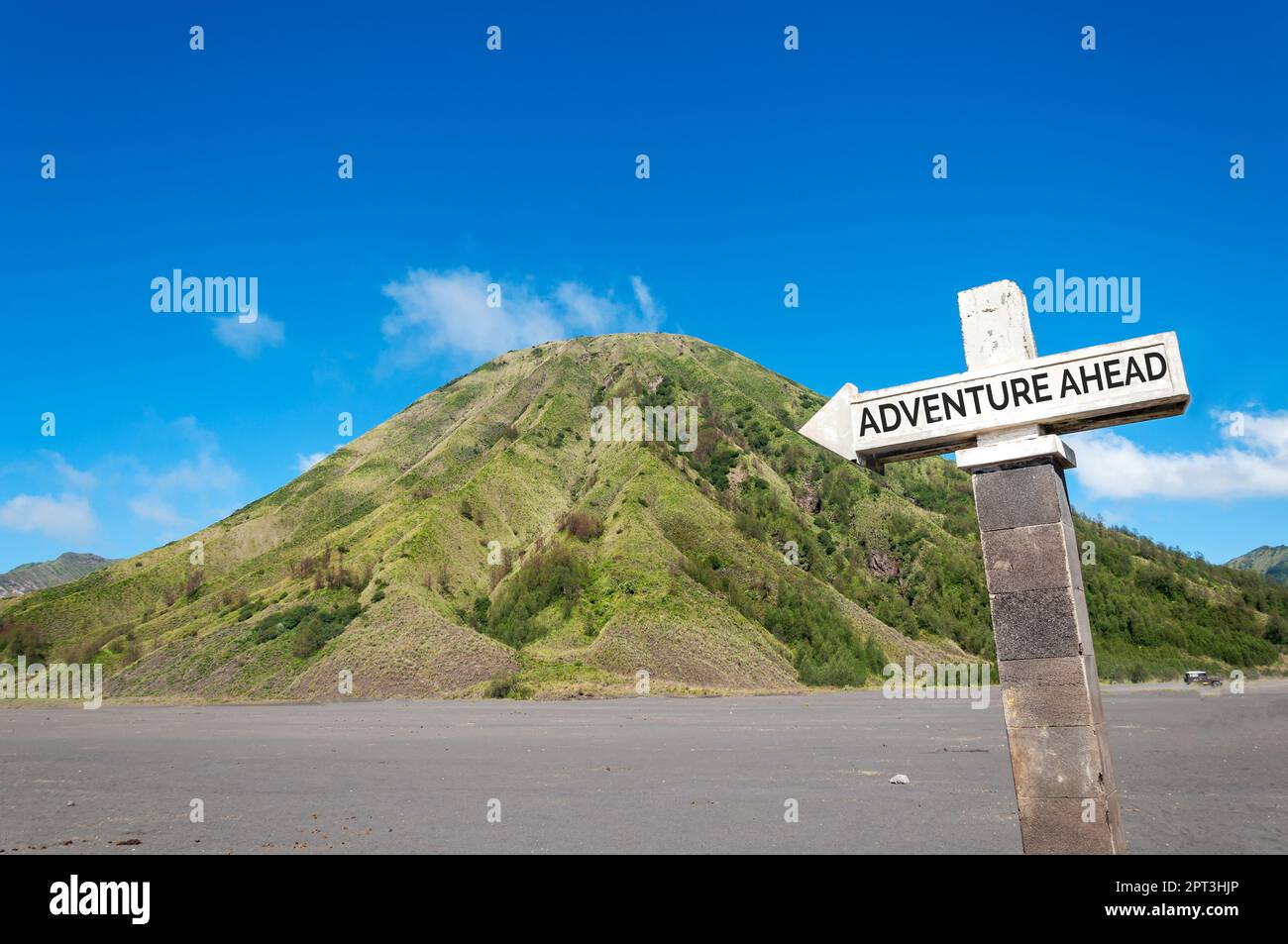 Direction arrow sign with text - Adventure ahead Stock Photo - Alamy