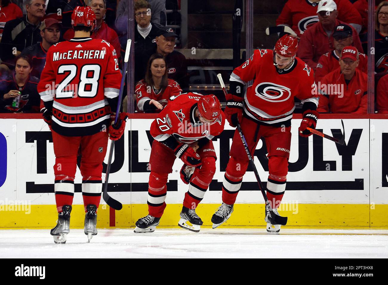 Carolina Hurricanes' Sebastian Aho (20) gets to his skates with the ...