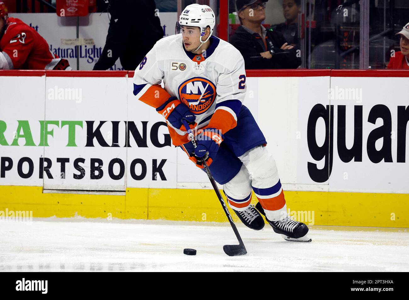 New York Islanders' Alexander Romanov (28) controls the puck against ...