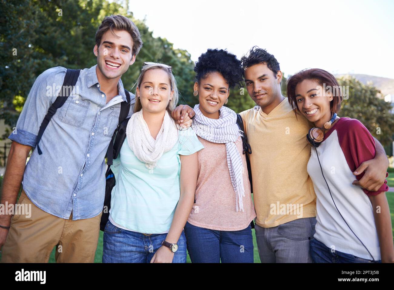 We learn and grow together. Portait of a group of friends standing ...
