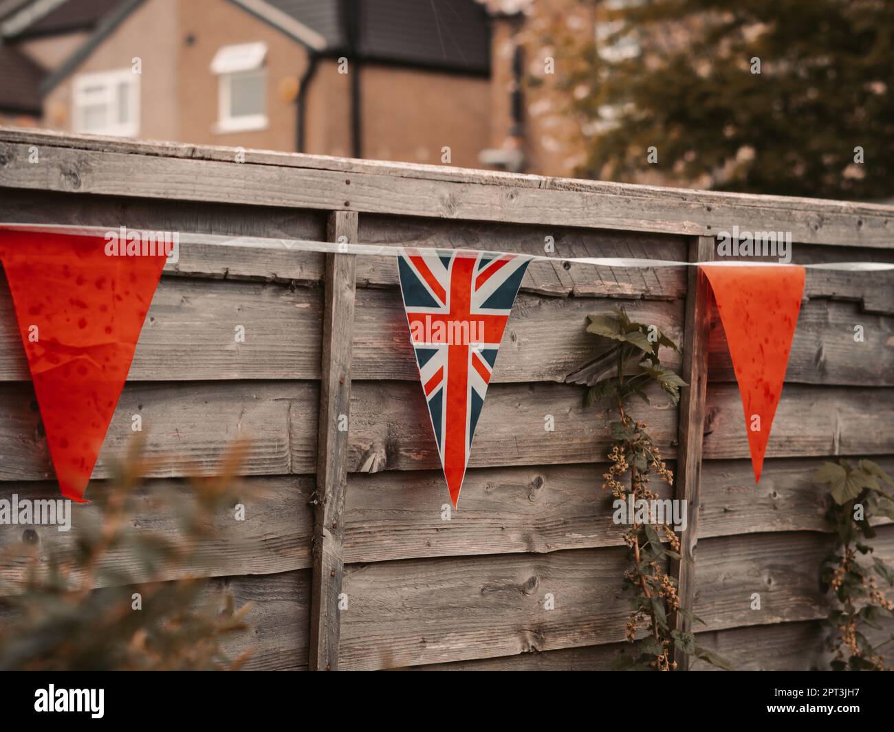 Flags of Great Britain waving on the wind in the garden of English ...