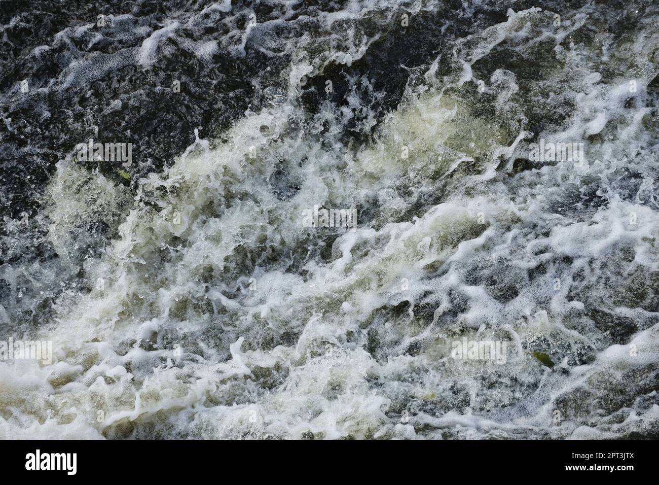 Waves of water of the river and the sea meet each other during high ...