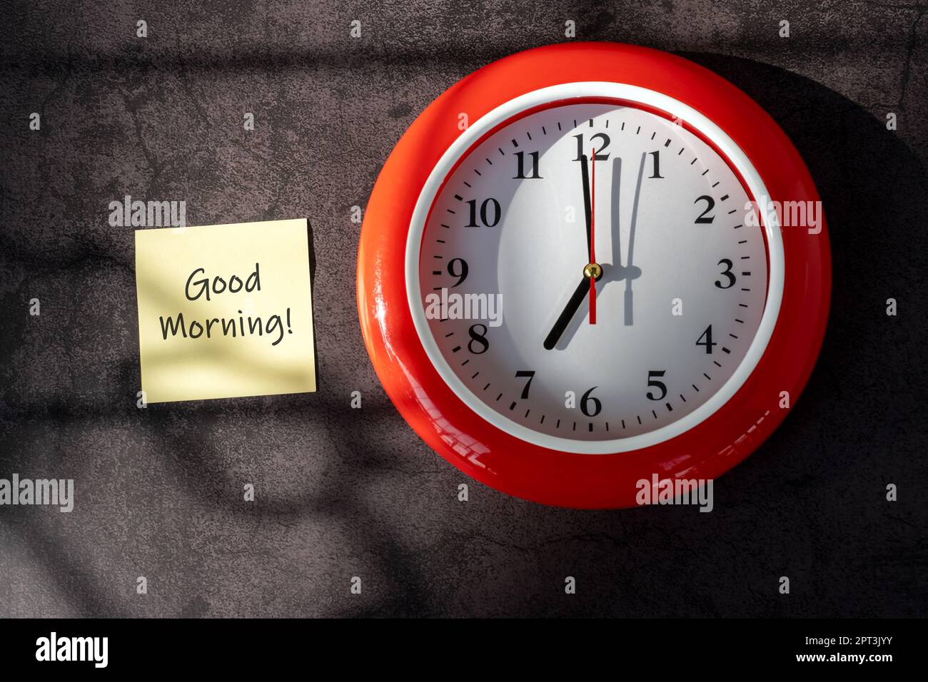 Clock and adhesive note with text - Good Morning. With shadow and light ...