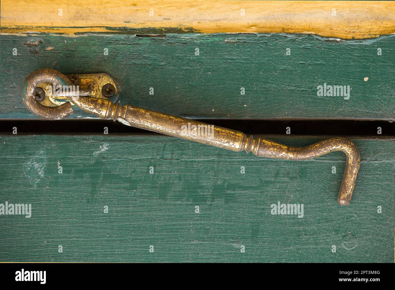 hook old brass window Used to attach doors or windows Stock Photo - Alamy