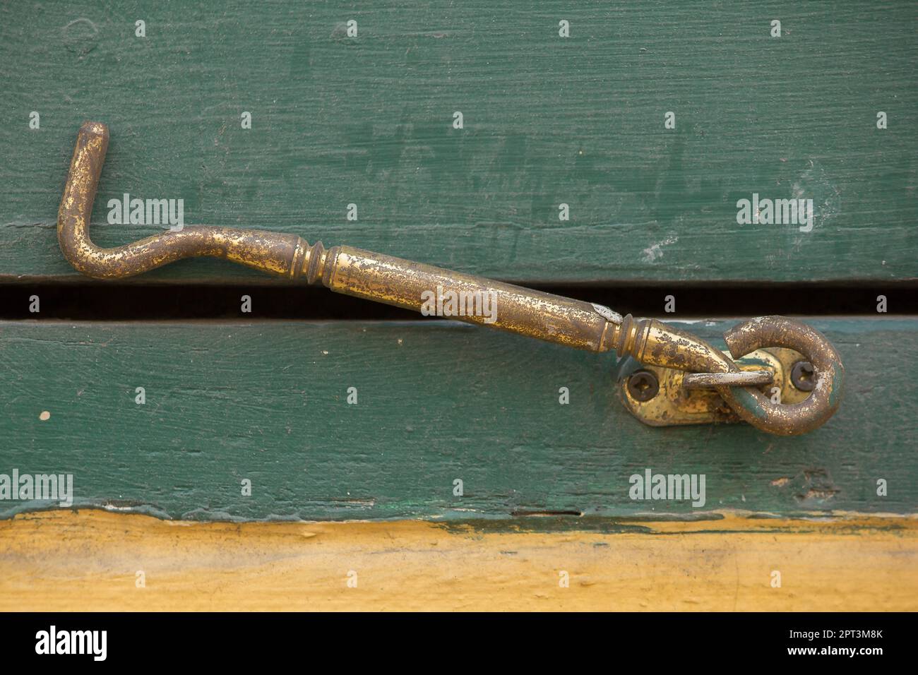 hook old brass window Used to attach doors or windows Stock Photo - Alamy
