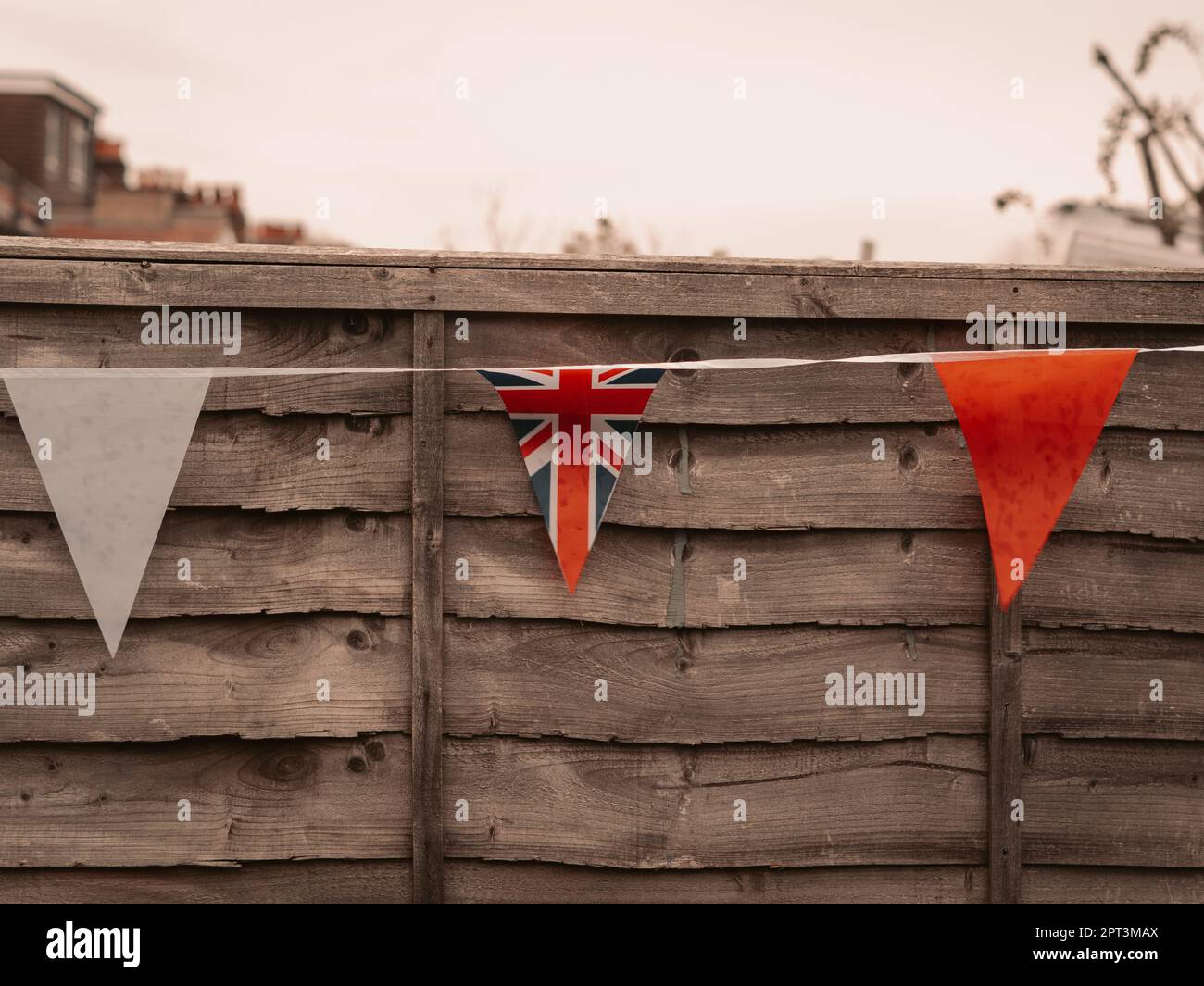 Flags of Great Britain waving on the wind in the garden of English ...