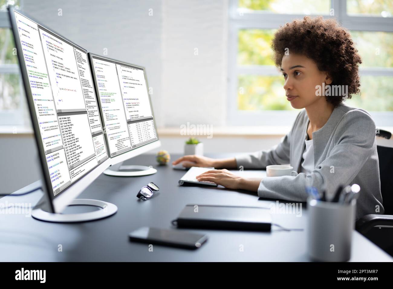 African American Woman Programmer. Girl Coding On Computer Stock Photo - Alamy