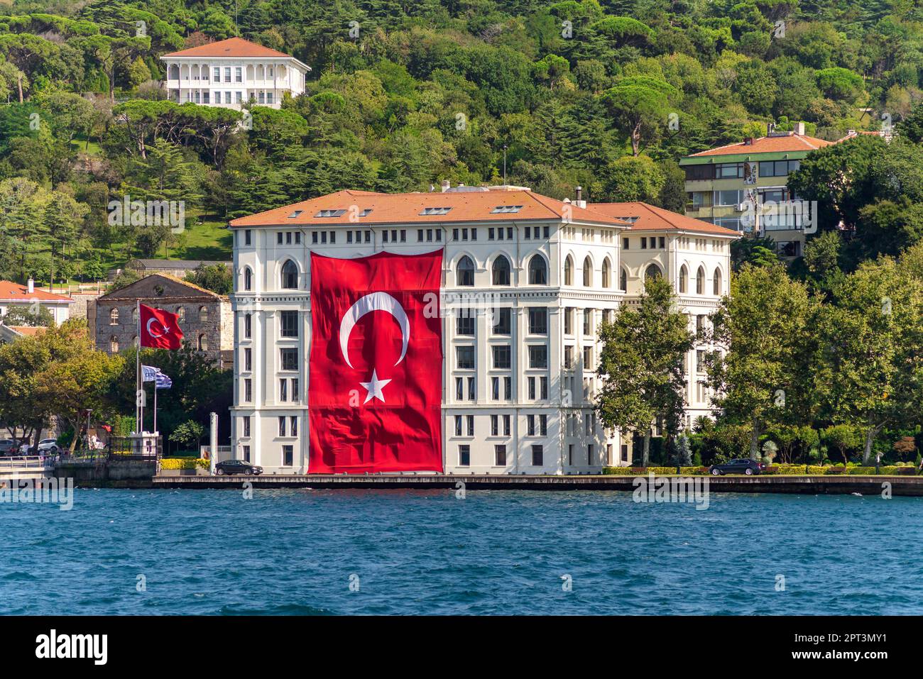 Traditional old waterside mansion, with huge Turkish Flag, suited in ...