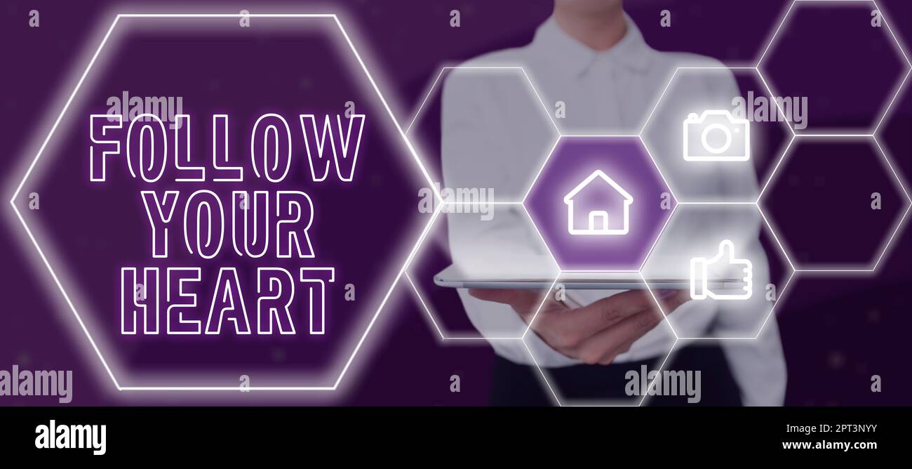 Hand writing sign Follow Your Heart, Internet Concept Motivation to do ...
