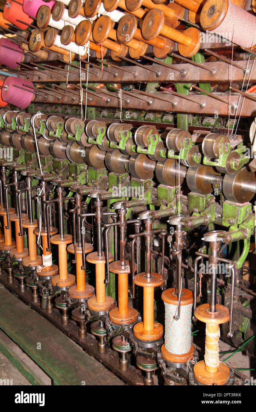 The Cogs and Bobbins of a Vintage Textile Machine Stock Photo - Alamy