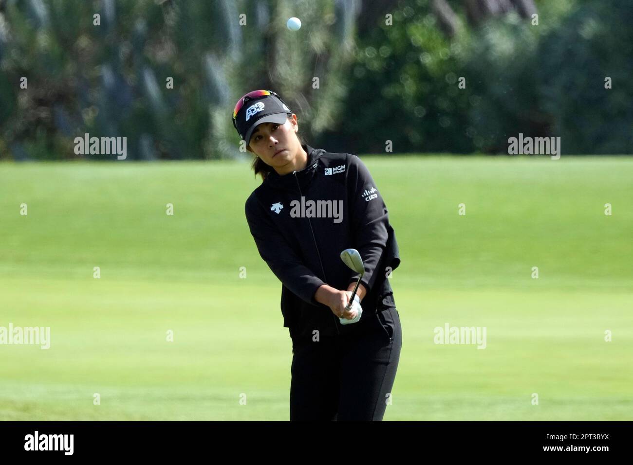 Danielle Kang chips to the 15th green during the first round of the LPGA LA Championship golf ...