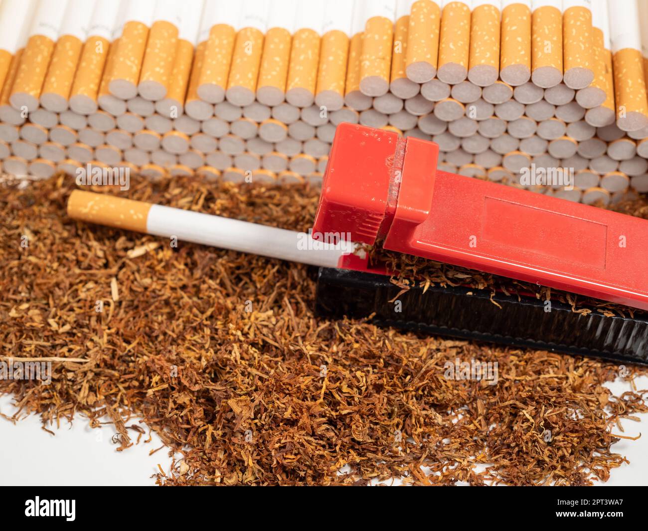 Tobacco and filling machine. Cigarettes and tobacco. Tobacco close-up ...