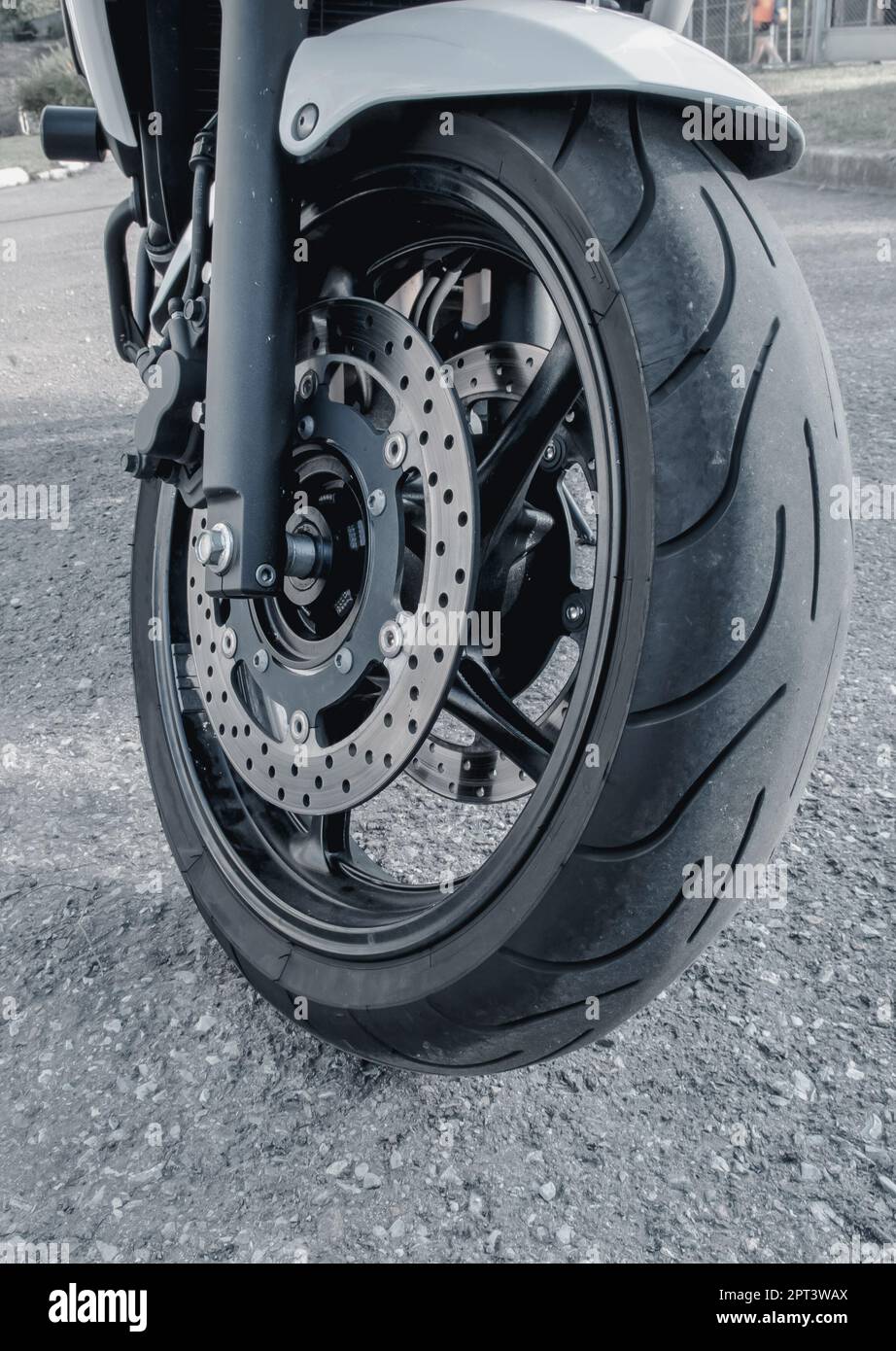 Front wheel motorcycle for racing on road Stock Photo - Alamy
