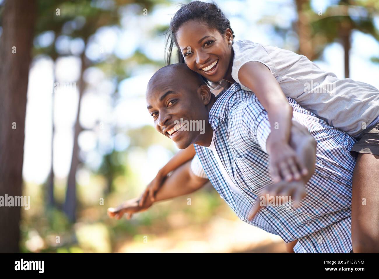 Always playful and affectionate. Portrait of a husband carrying his ...