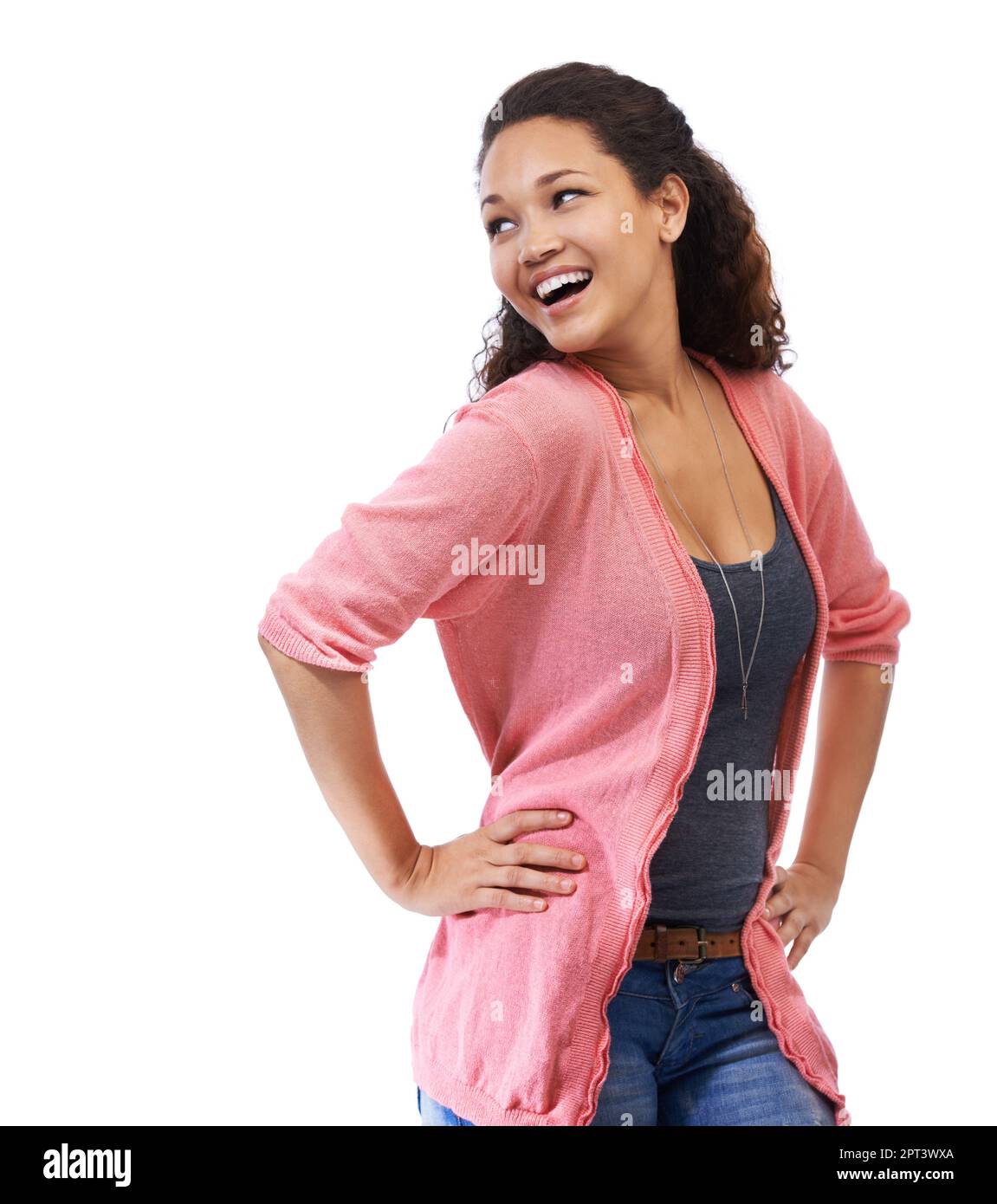 Fun and flirty. A beautiful young woman smiling with her hands on her ...