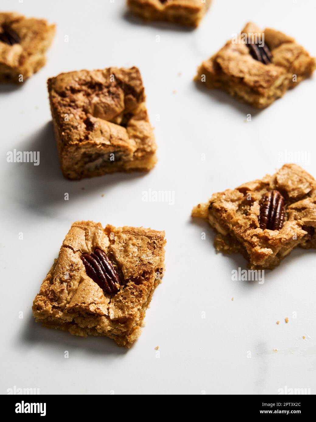 blondie cookies squares on white marble countertop background. White ...