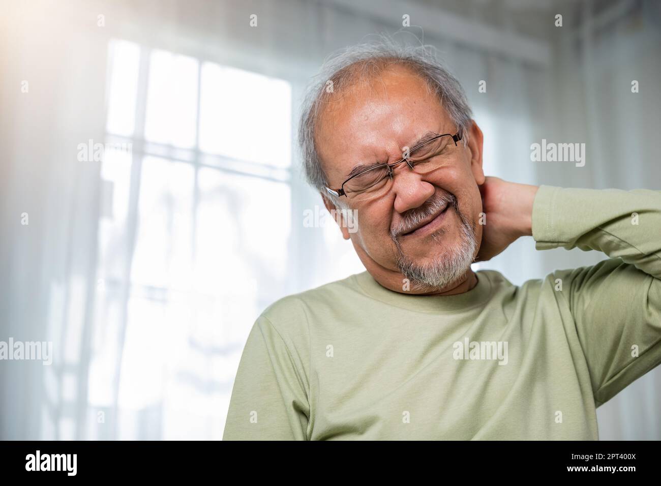 Old man suffering from nape neck pain at home, Elderly acute neckaches ...