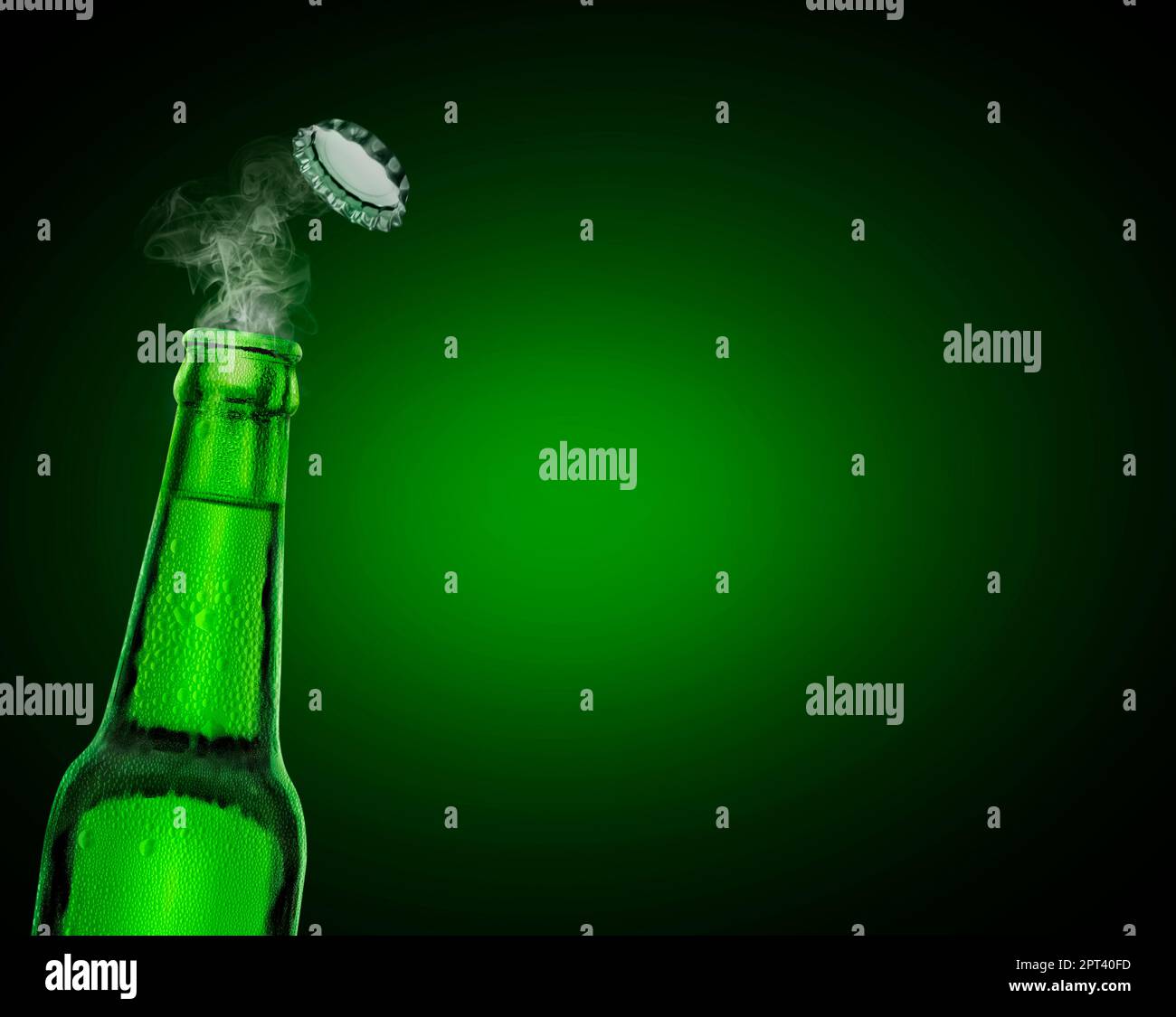 cold wet open beer bottle with smoke on green background Stock Photo ...