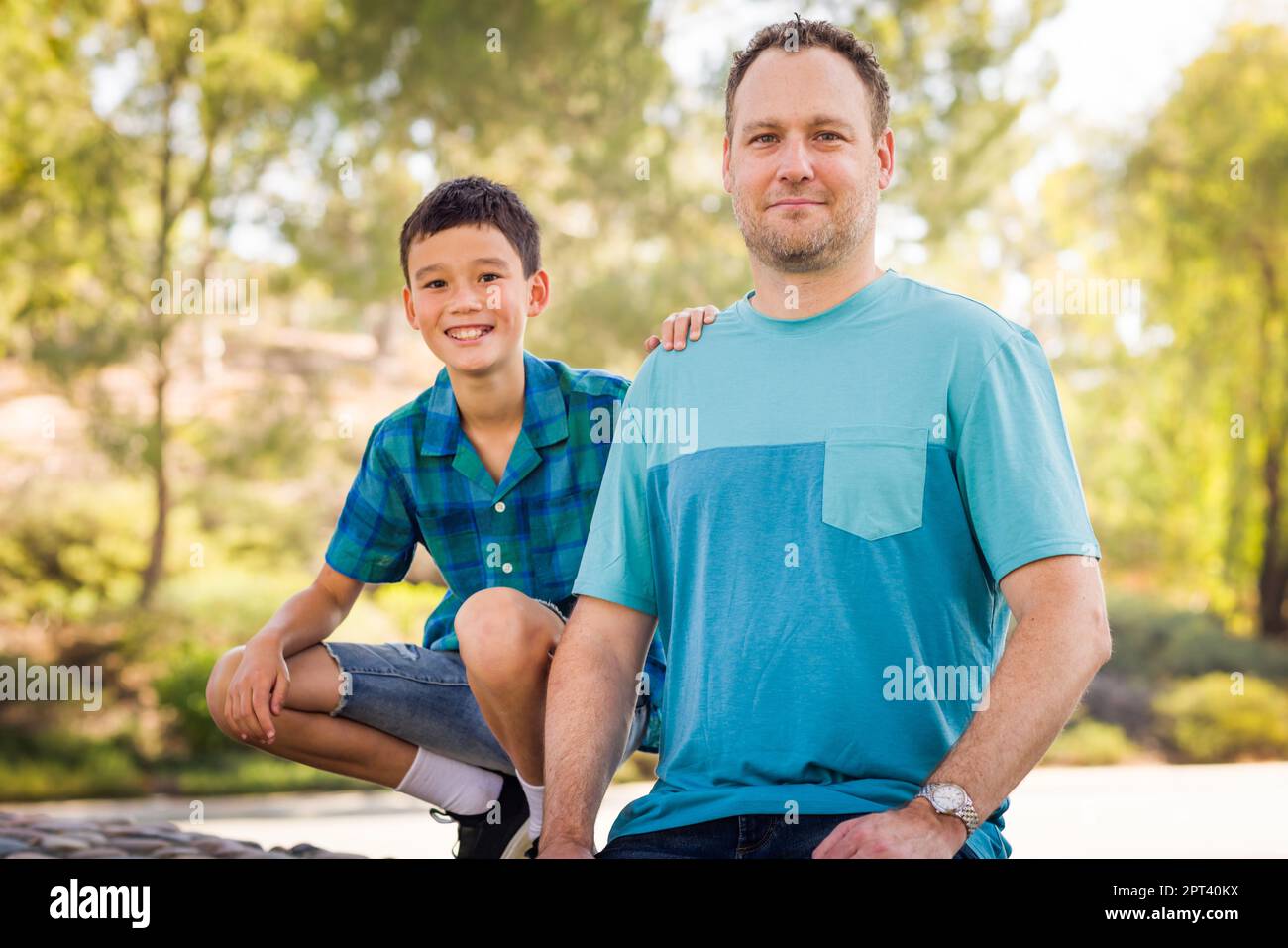 Outdoor portrait of biracial Chinese and Caucasian father and son Stock ...