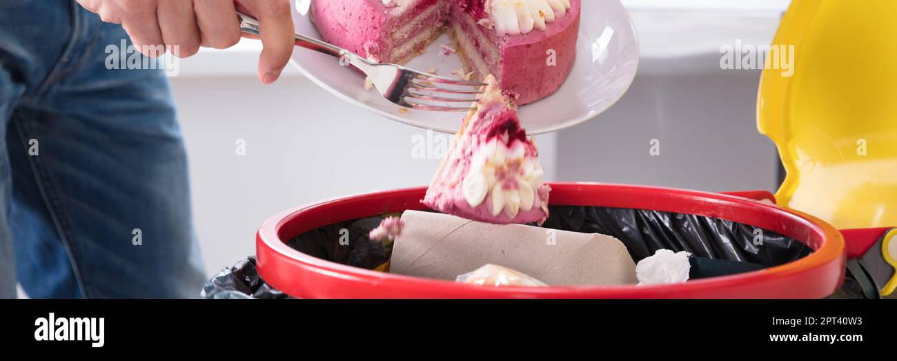 Throw Away Cake Food In Waste Bin Stock Photo - Alamy