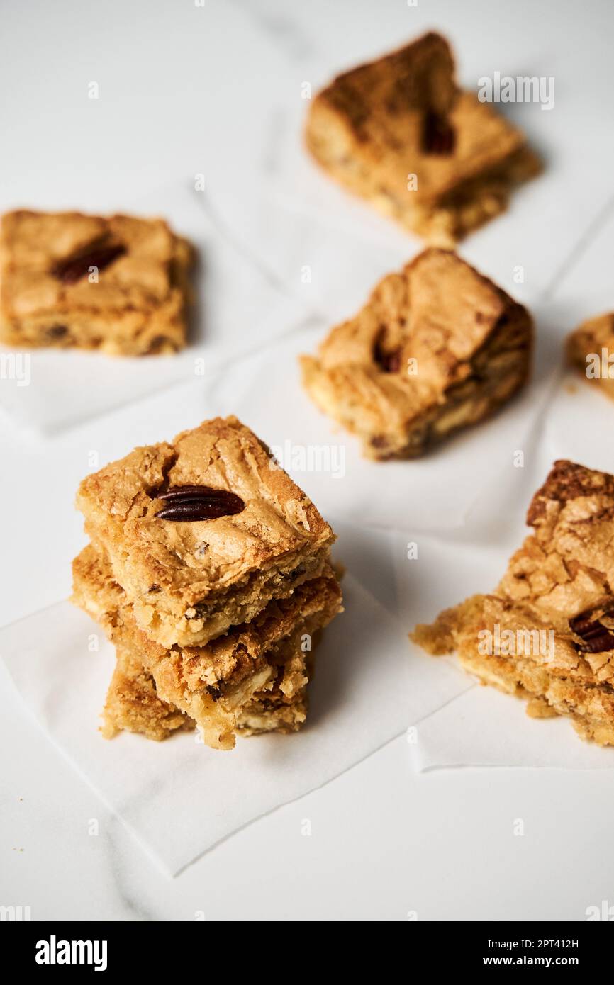 blondie cookies squares on white marble countertop background. White ...
