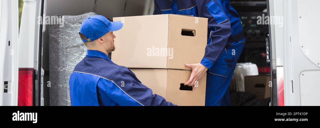 Van Movers Unloading Cardboard Boxes From Delivery Truck Stock Photo ...