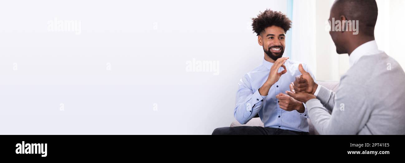 Two people talking sign language hi-res stock photography and images ...