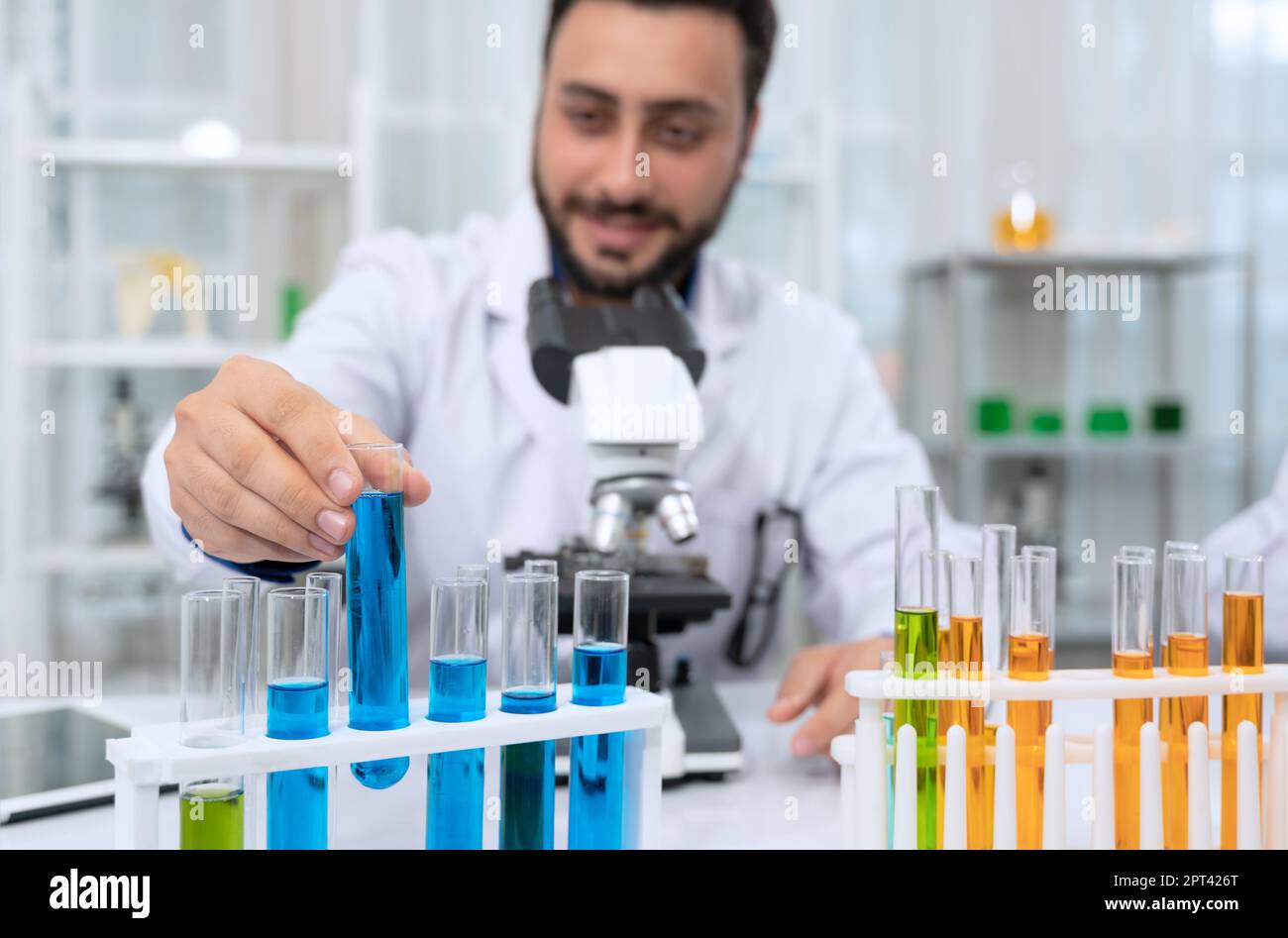 Scientist wearing white laboratory coat in reserch laboratory. Man ...