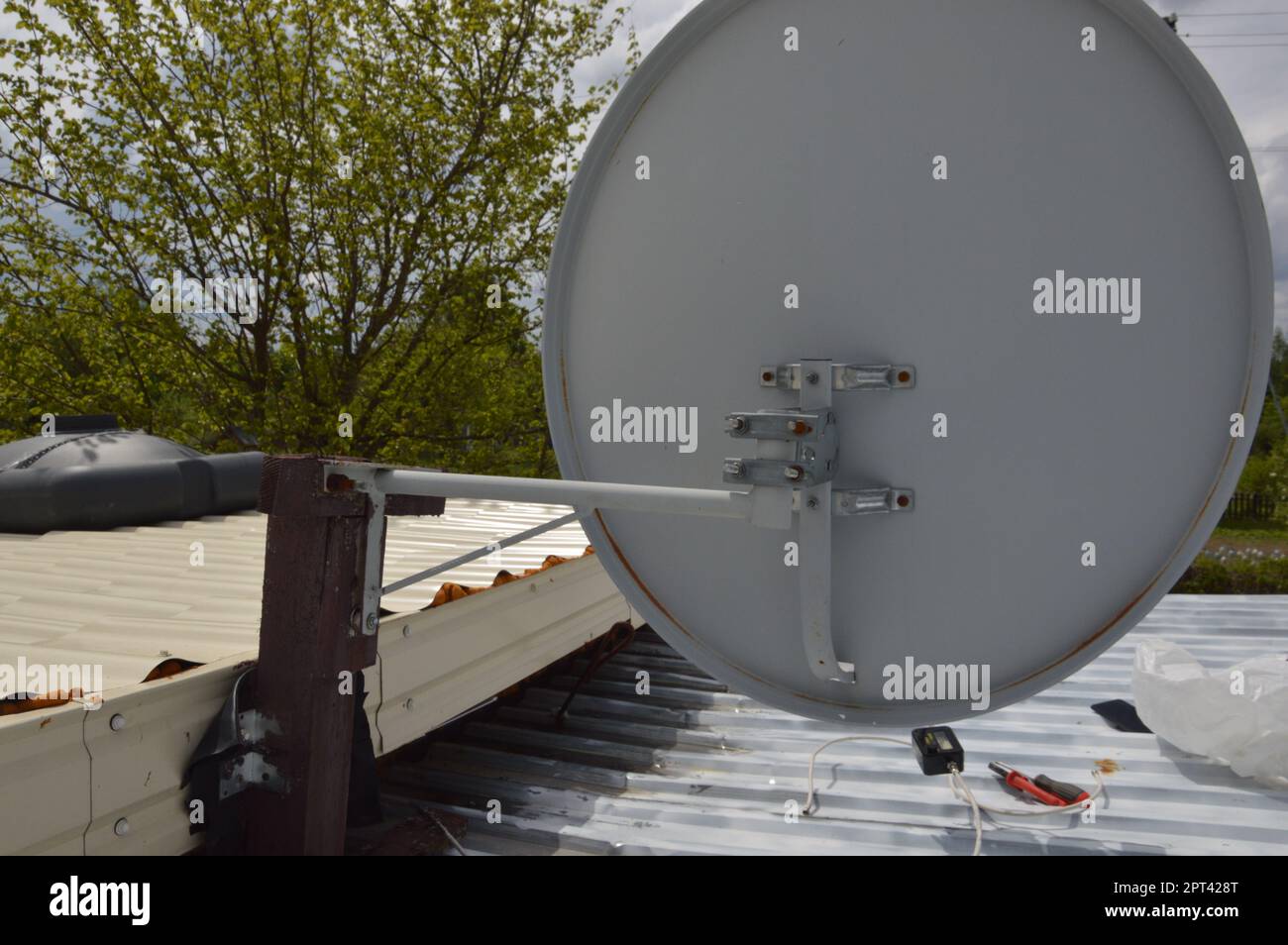 Installation and configuration of a satellite television a dish Stock ...