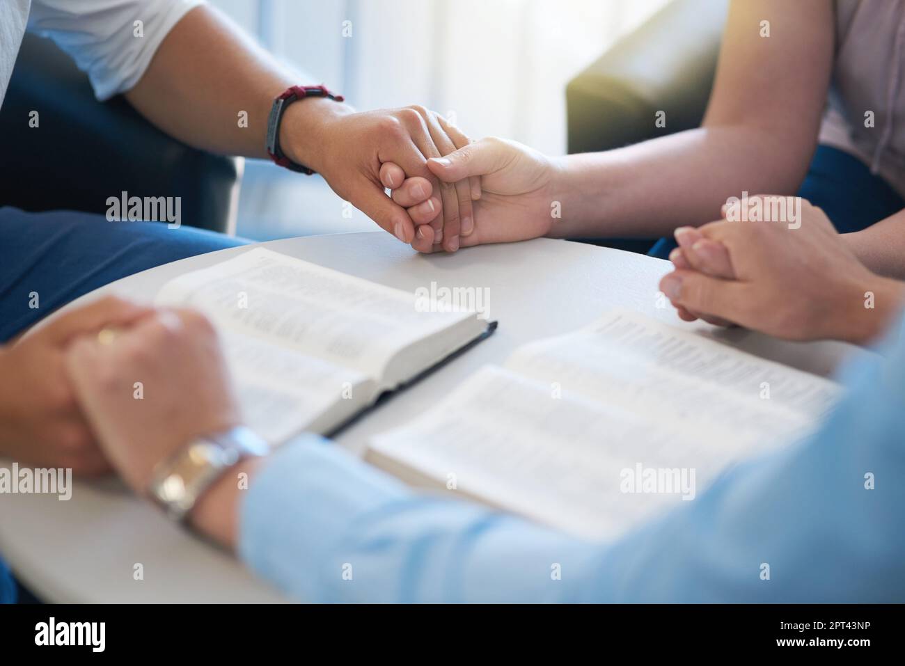 Were strengthening our team through prayer. a group of young ...