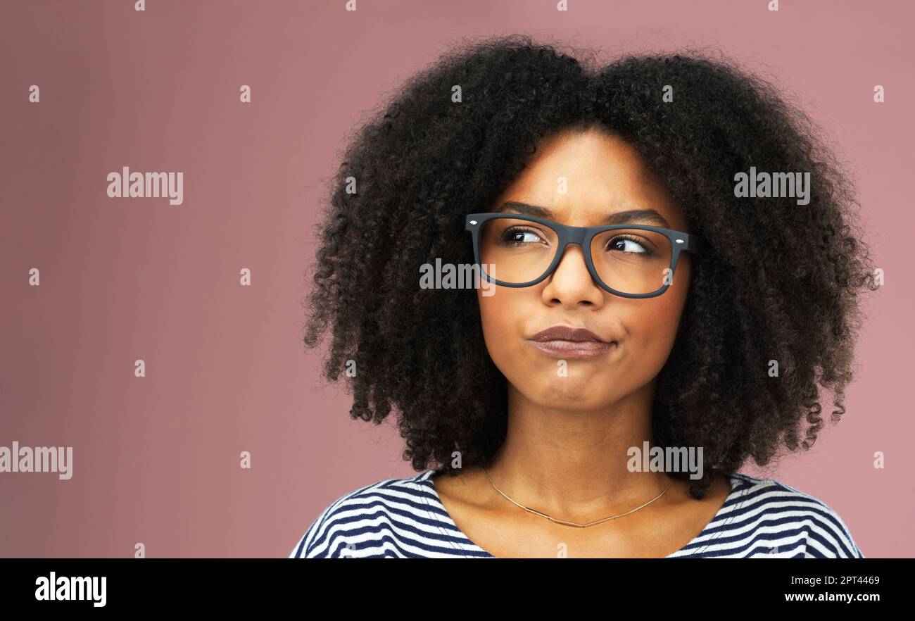 Im feeling very suspicious. a beautiful young woman posing with reading ...