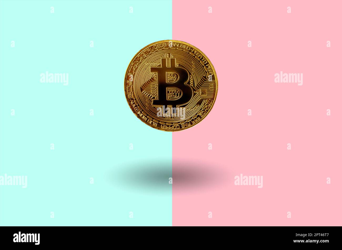Golden bitcoin floating in background of pastel pink and blue ...
