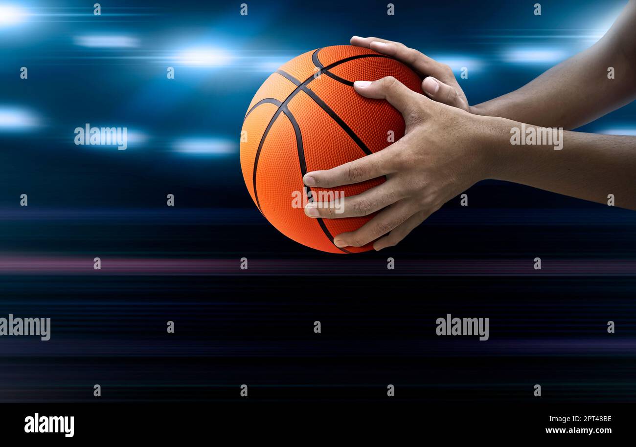 basketball ball in man's hand in competition Stock Photo - Alamy