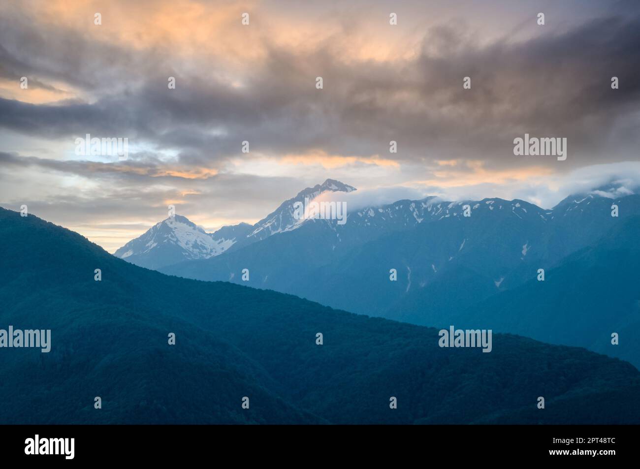 Mountain landscape. Snowy peak. Fog and aerial perspective Stock Photo ...