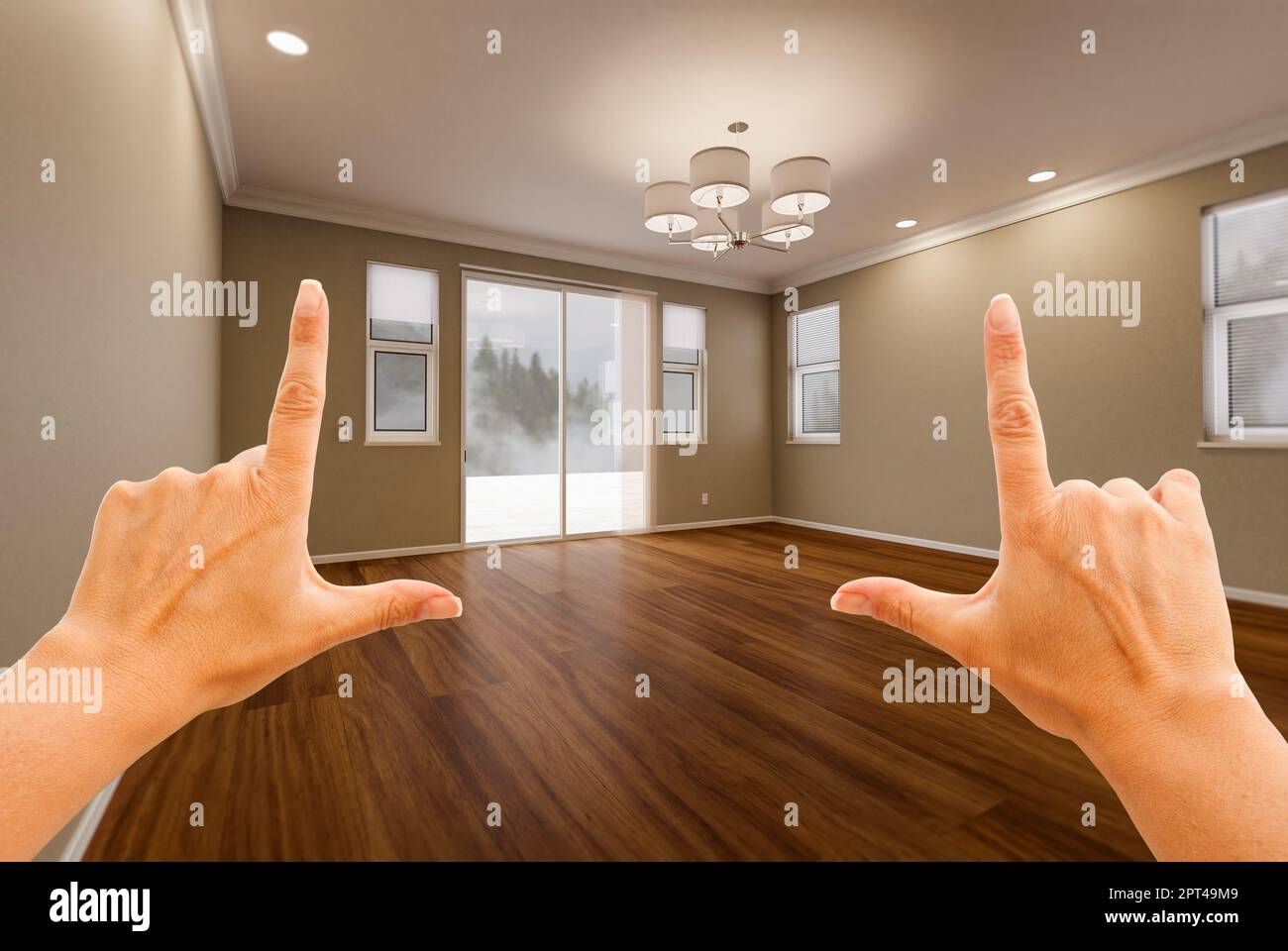 Female Hands Framing Empty Room of New House Stock Photo - Alamy