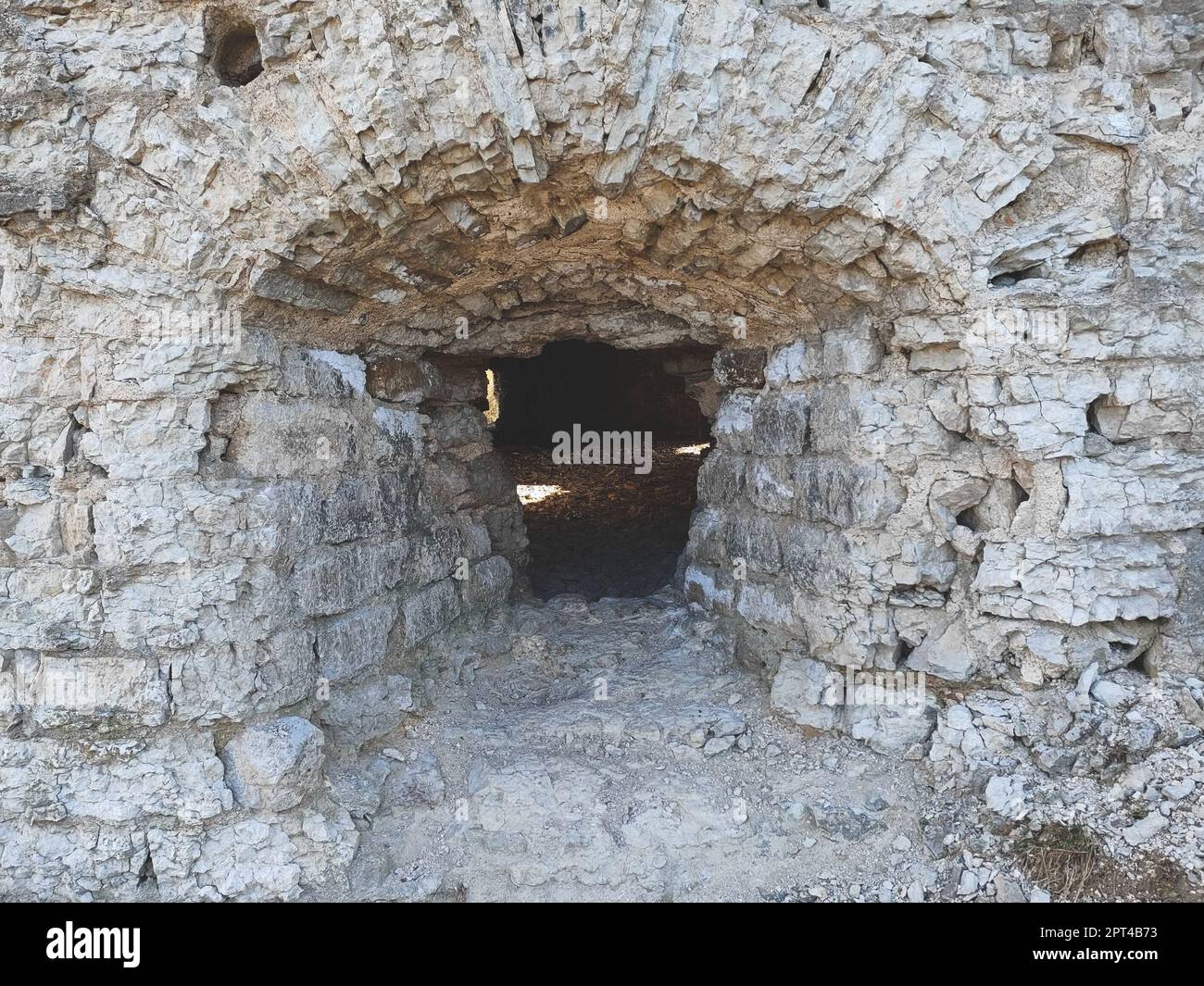Ancient window hole in old stone wall of medieval tower Stock Photo - Alamy